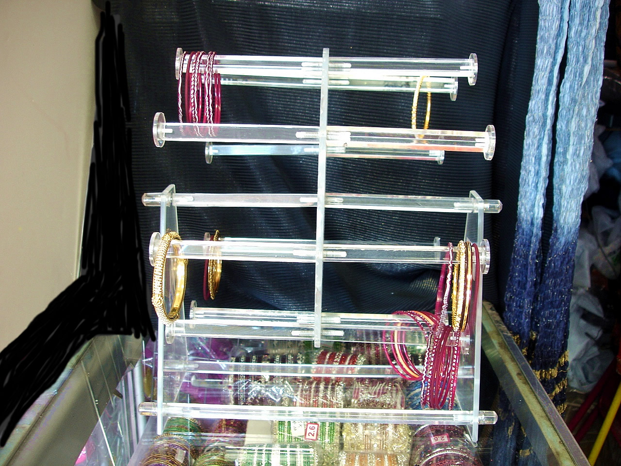 Indian bangle stand and bangle storage plastic box.