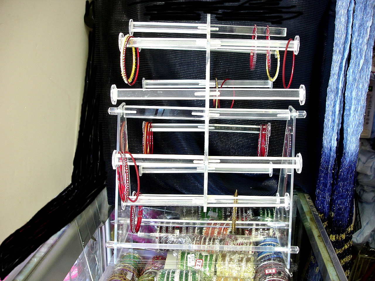 Indian bangle stand and bangle storage plastic box.